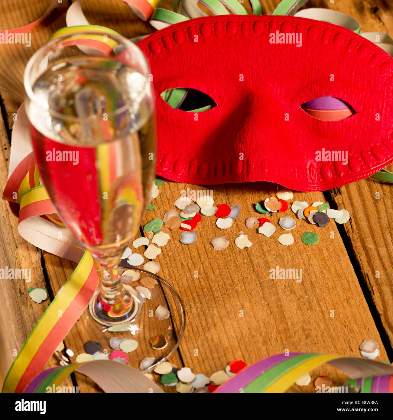 Still life with carnival mask and colored glitter Stock Photo - Alamy