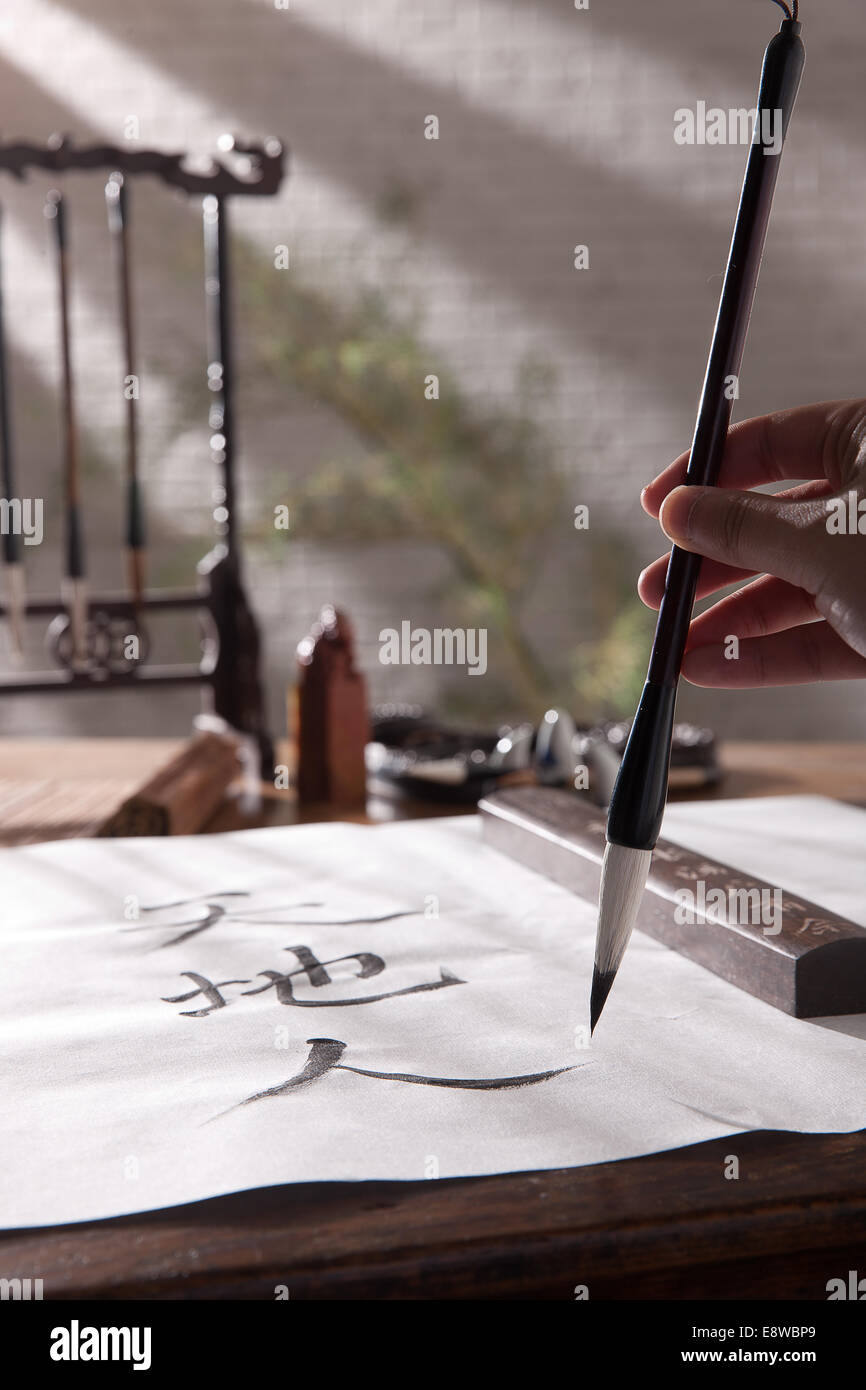 Hand write with a brush Stock Photo - Alamy