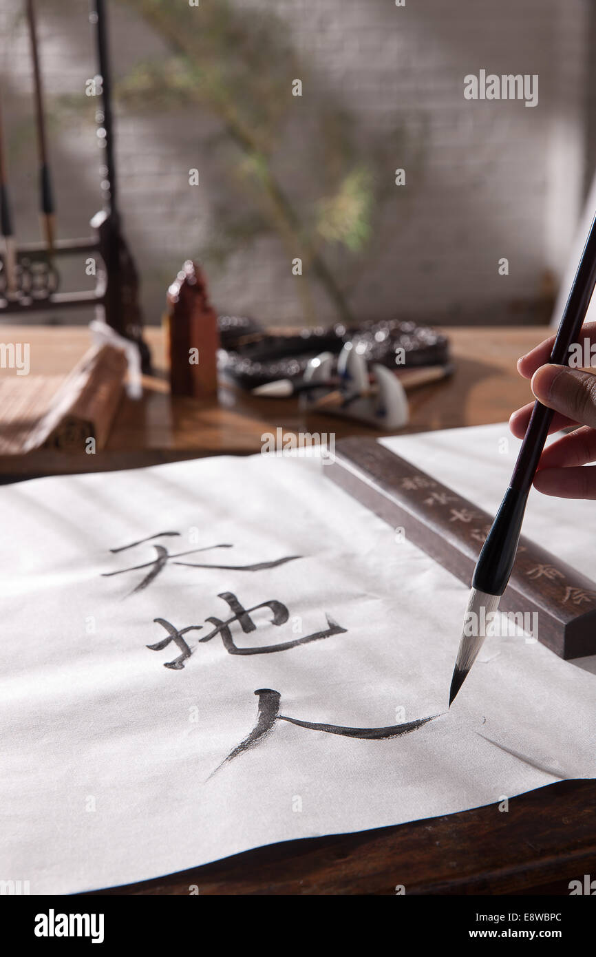 Hand write with a brush Stock Photo - Alamy