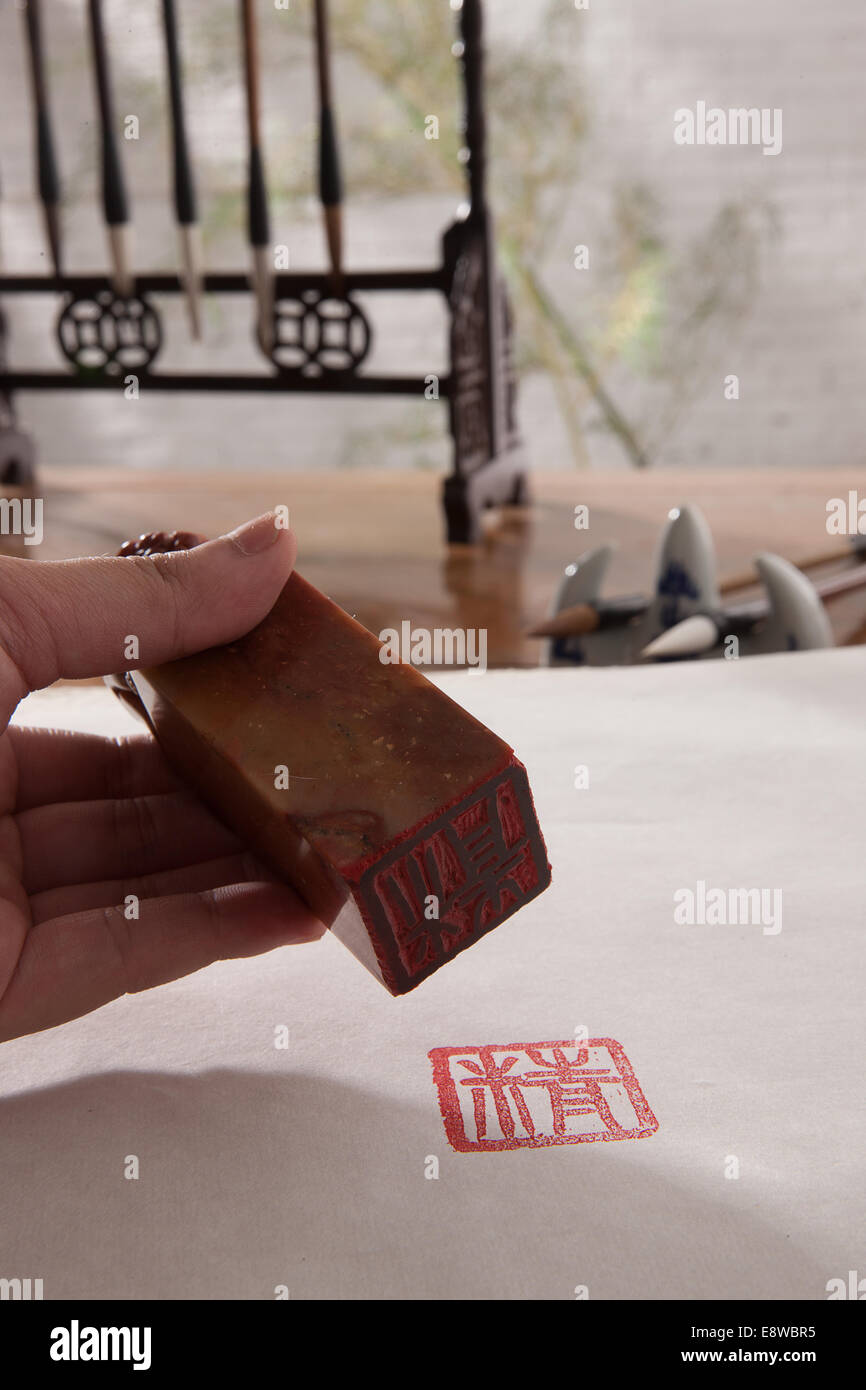 Holding a stamp Stock Photo - Alamy