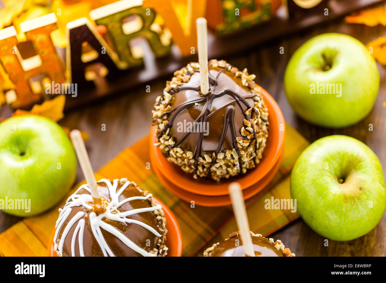 Hand dipped caramel apples decorated for Halloween Stock Photo - Alamy