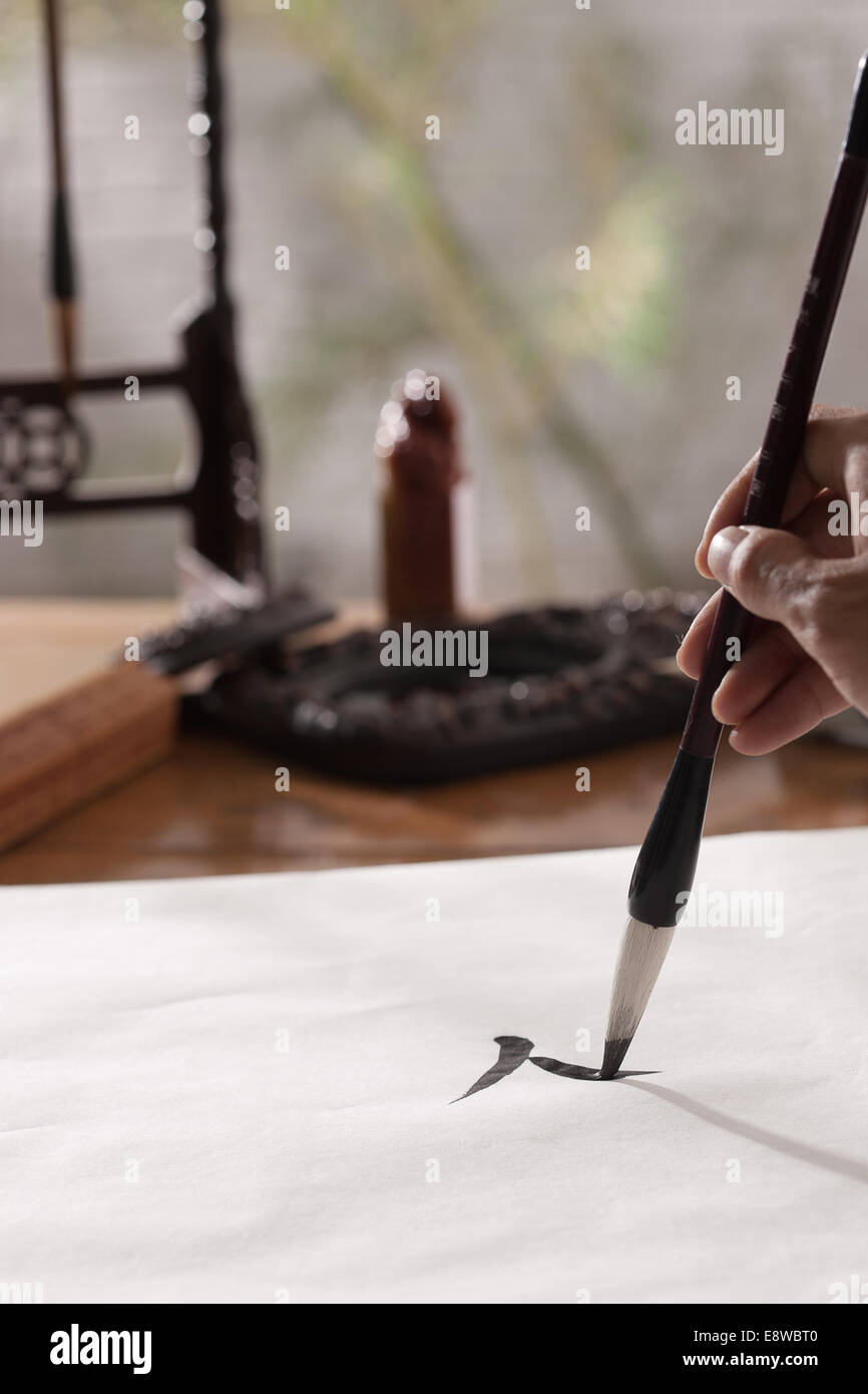 Hand write with a brush Stock Photo - Alamy