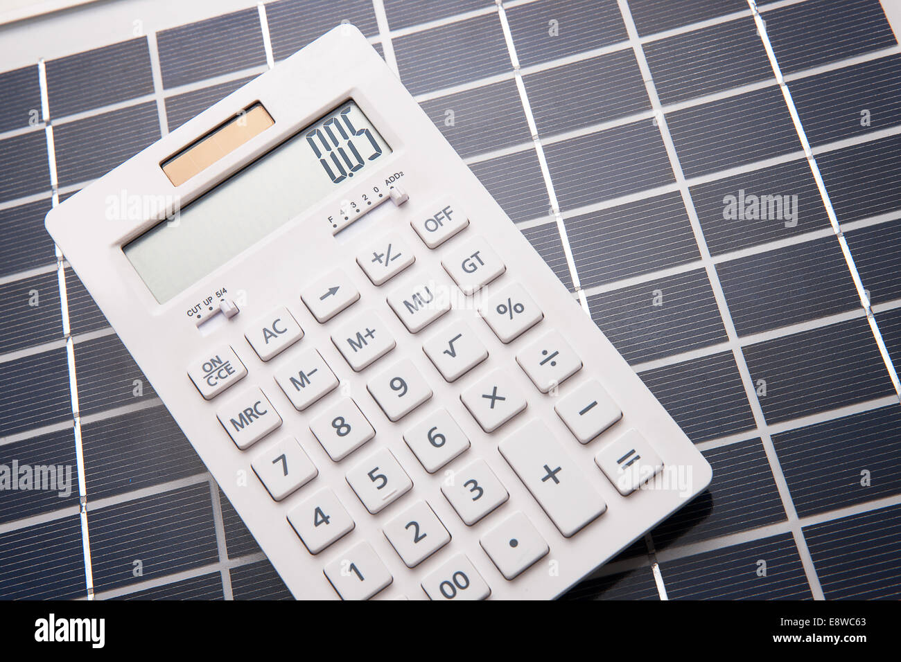 Calculator solar panels Stock Photo - Alamy