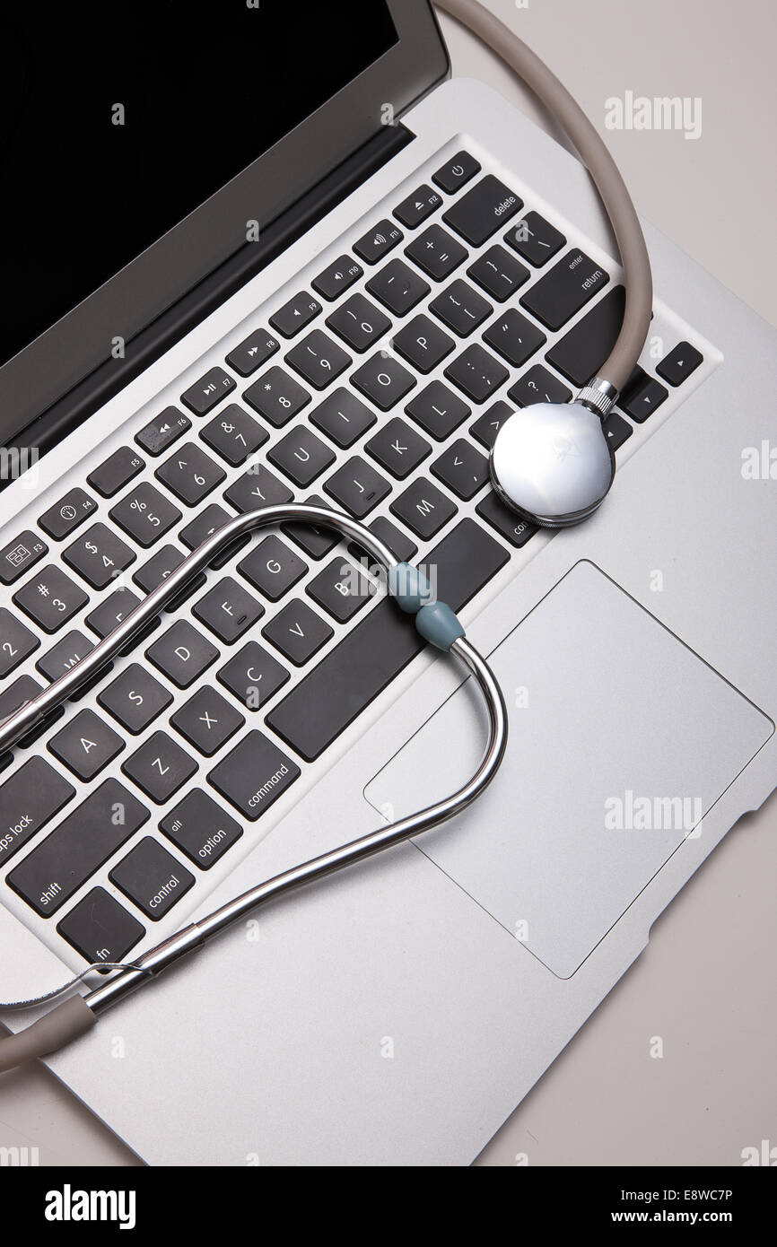 Laptop with a stethoscope Stock Photo - Alamy