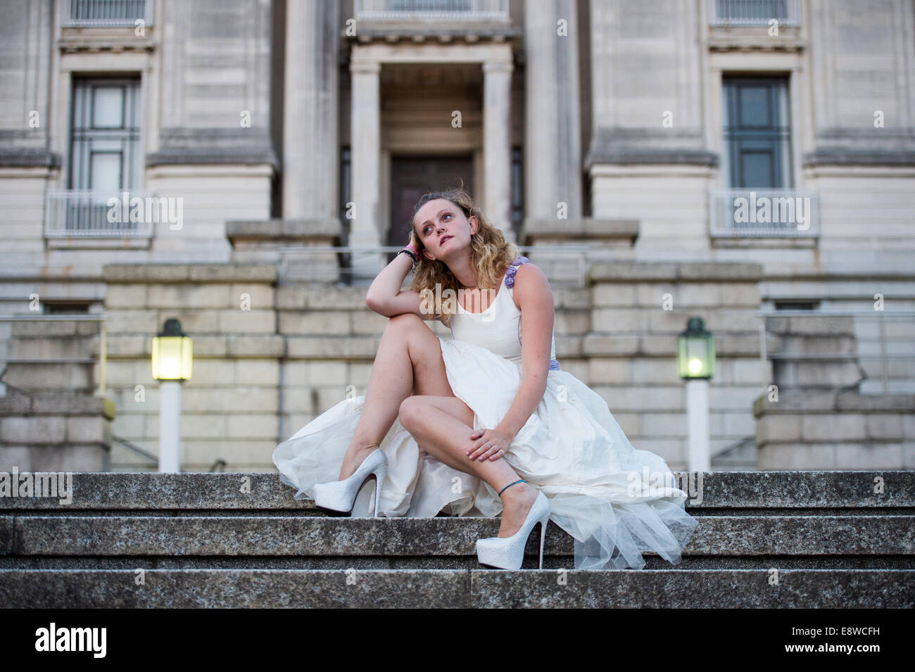 The runaway or jilted bride - a young woman girl in a wedding dress ...
