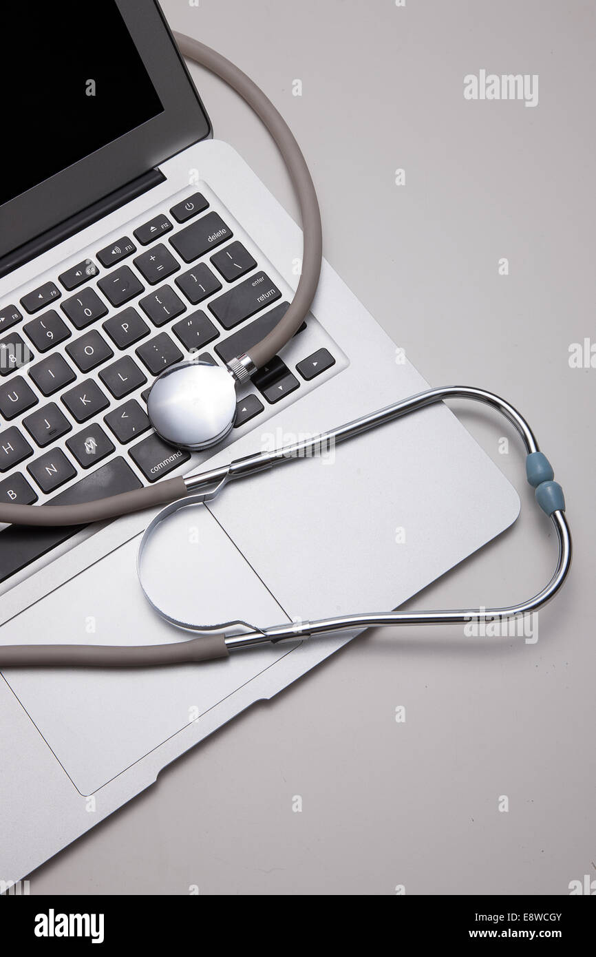 Laptop with a stethoscope Stock Photo - Alamy