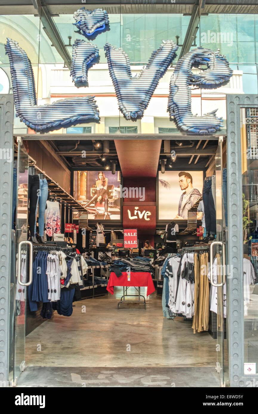 Live fashion shop front and signage Stock Photo - Alamy