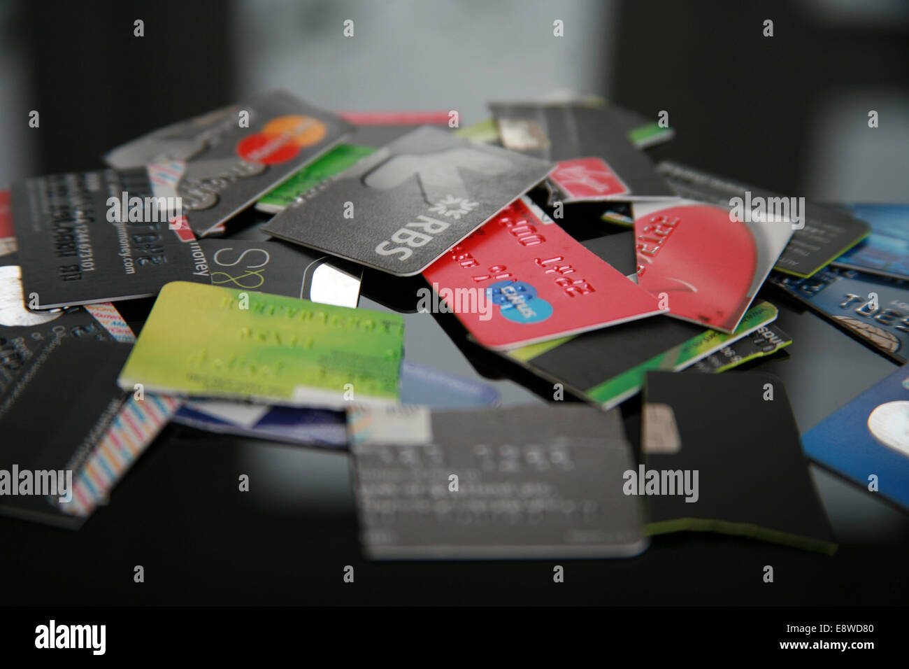 Credit cards cut into pieces Stock Photo - Alamy