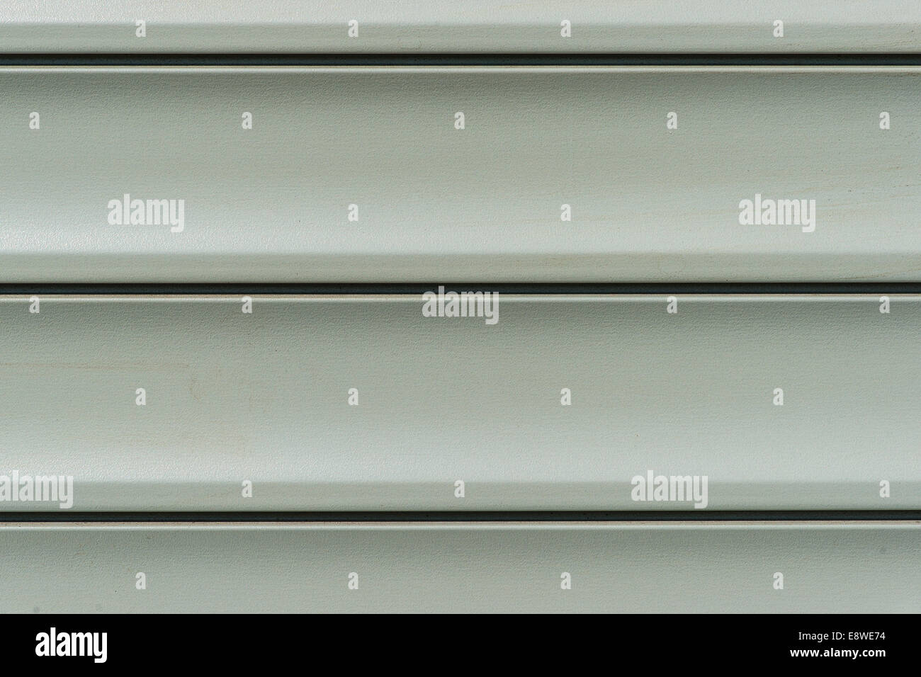 Horizontal metal shutters texture of gray color. The shop is closed ...