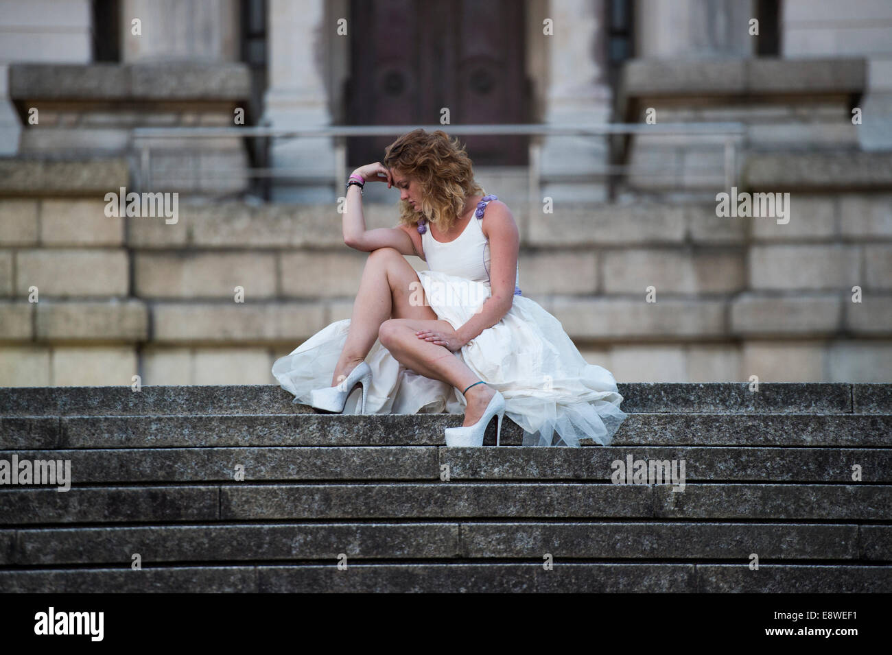 The runaway or jilted bride - a young woman girl in a wedding dress ...