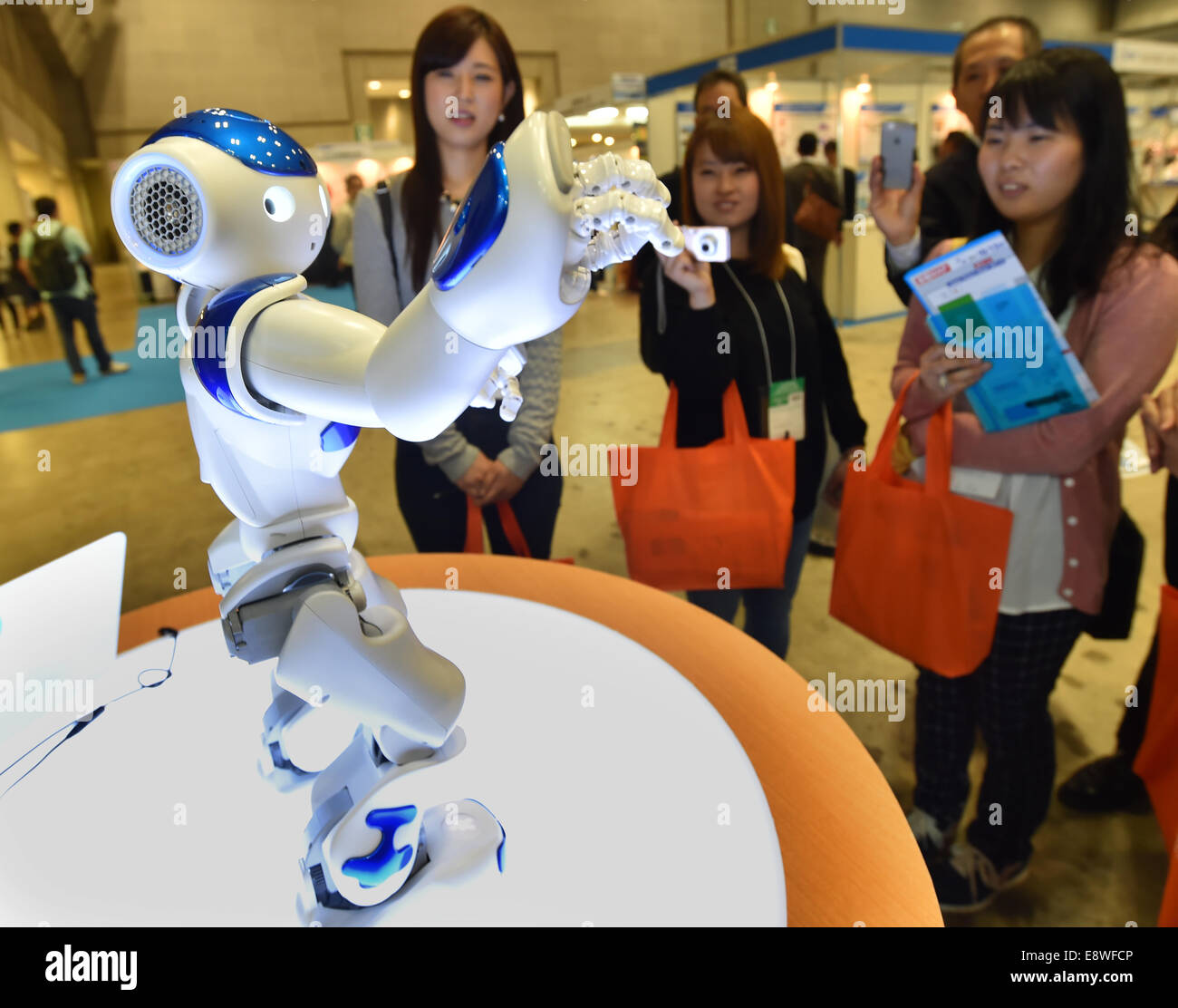 Tokyo, Japan. 15th Oct, 2014. "NAO," a programmable robot demonstrates ...