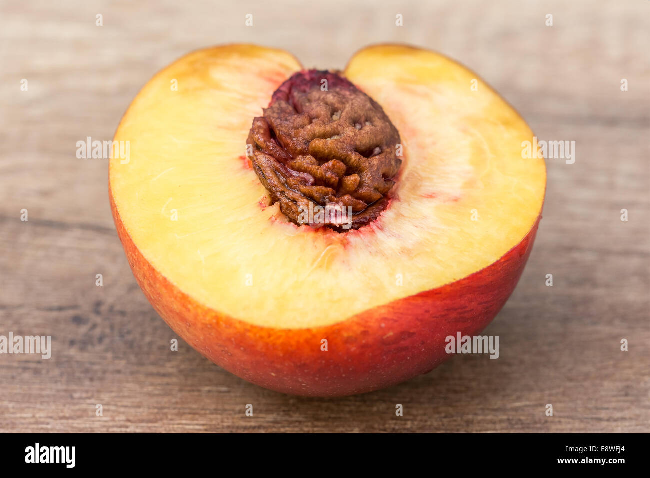 Sliced nectarine on wood hi-res stock photography and images - Alamy