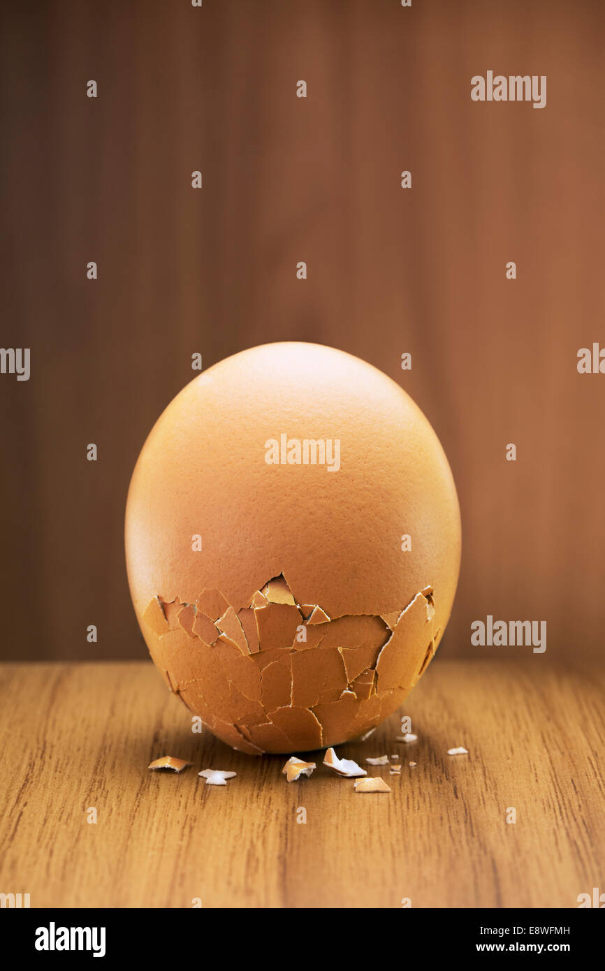 Close up of egg cracking on counter Stock Photo - Alamy