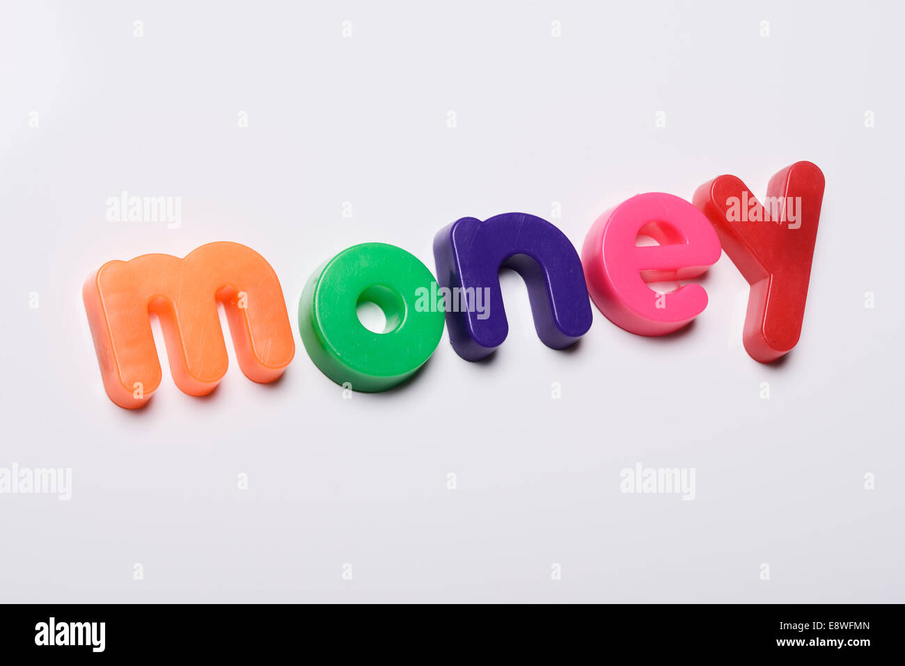 Money made from magnetic fridge letters Stock Photo - Alamy