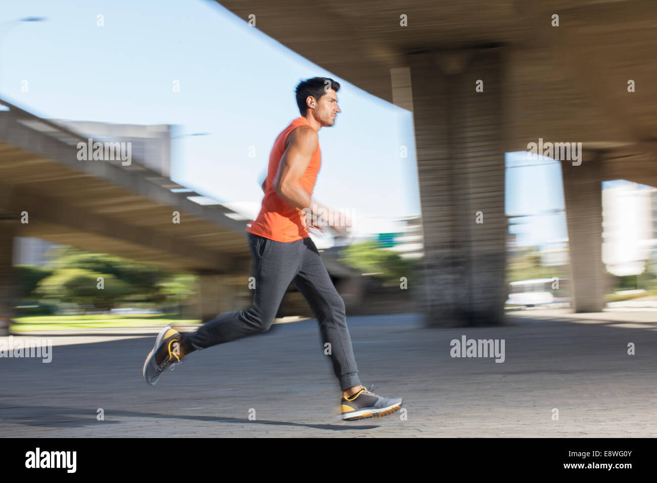 Man running through city streets Stock Photo - Alamy