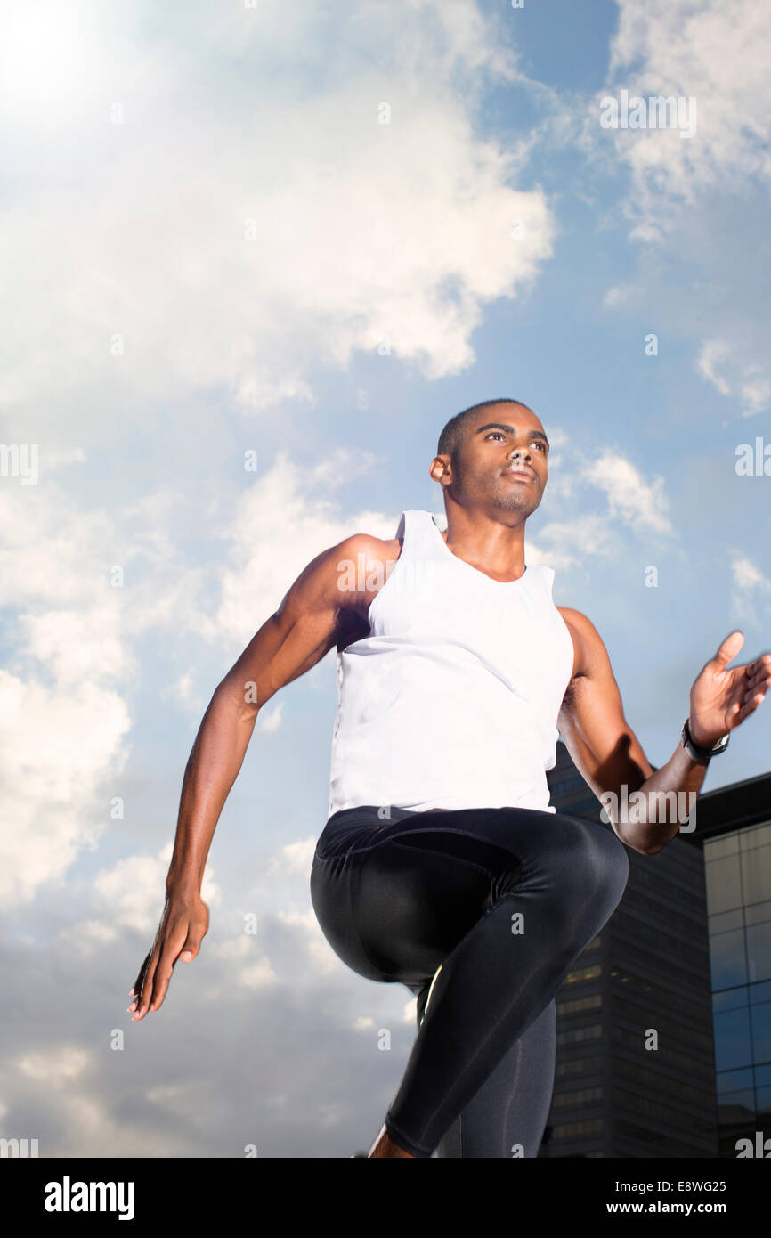 Man running through city streets Stock Photo - Alamy