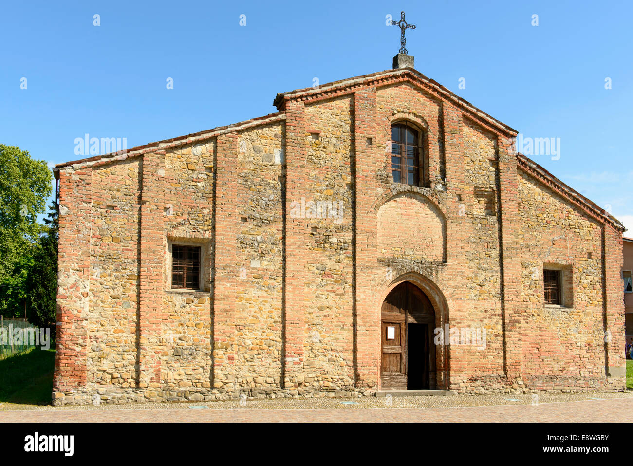 exterior view of main prospect of ancient Romanesque church in small ...