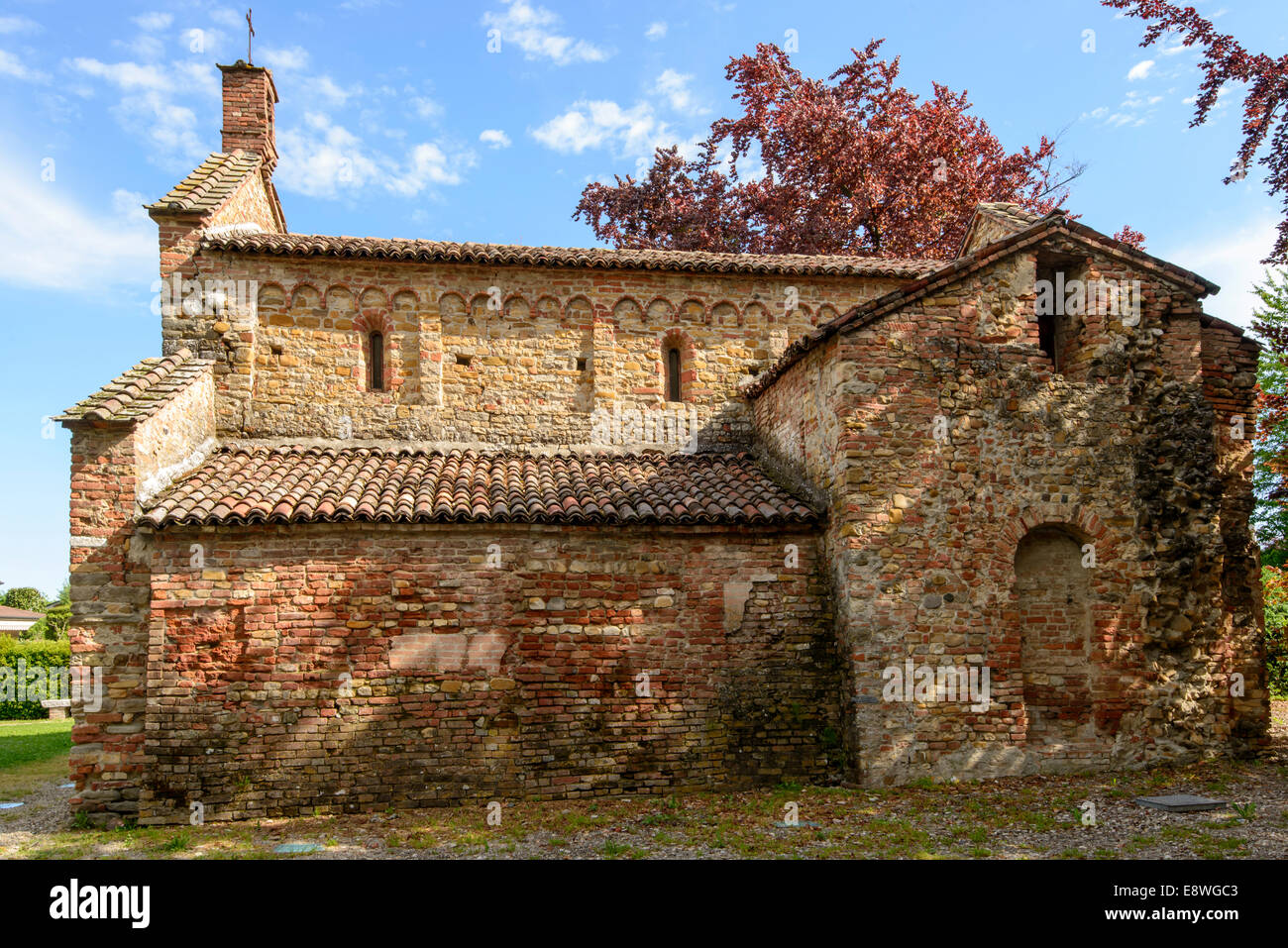 exterior view of south side of ancient Romanesque church in small ...