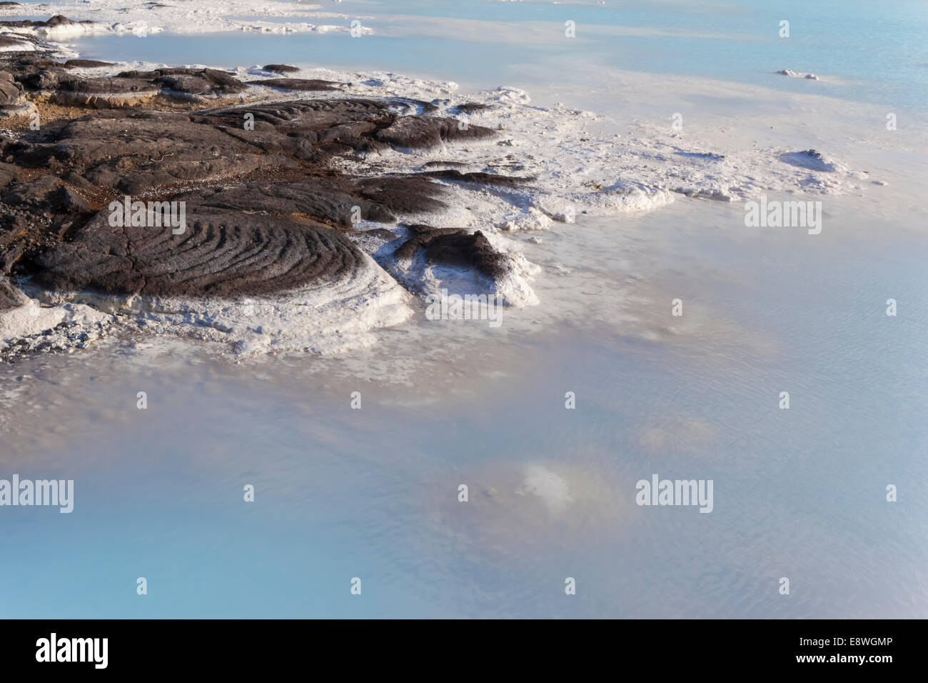 White limescale deposits against black lava rock at 'Blue Lagoon' in ...