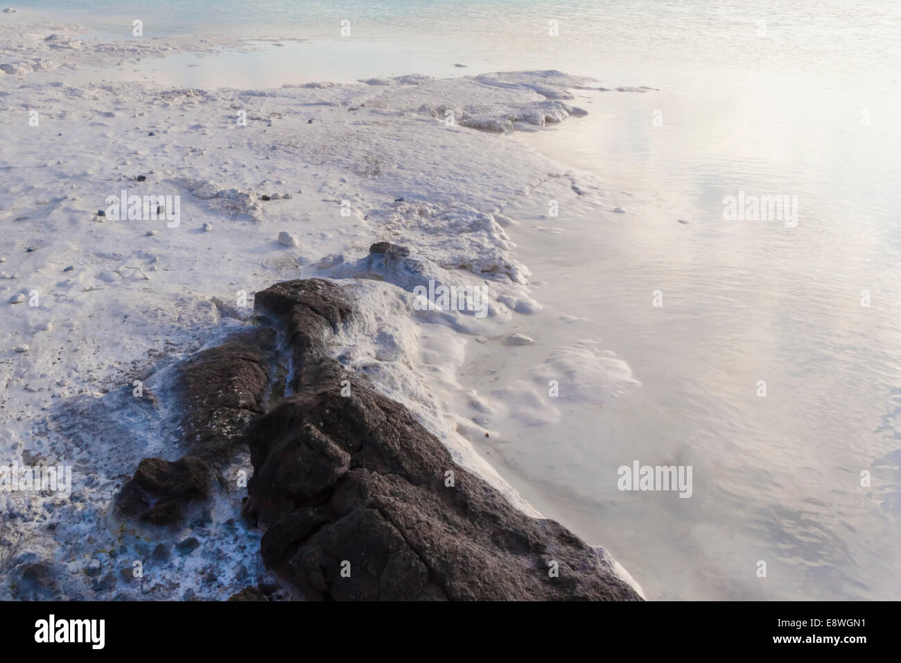 White limescale deposits against black lava rock at 'Blue Lagoon' in ...