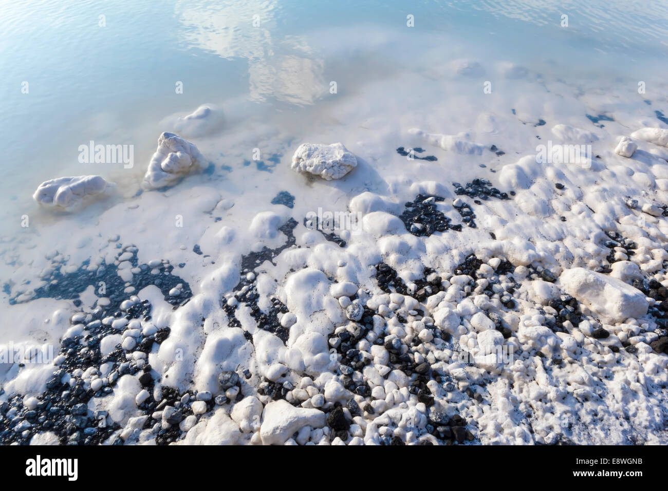 White limescale deposits against black lava rock at 'Blue Lagoon' in ...