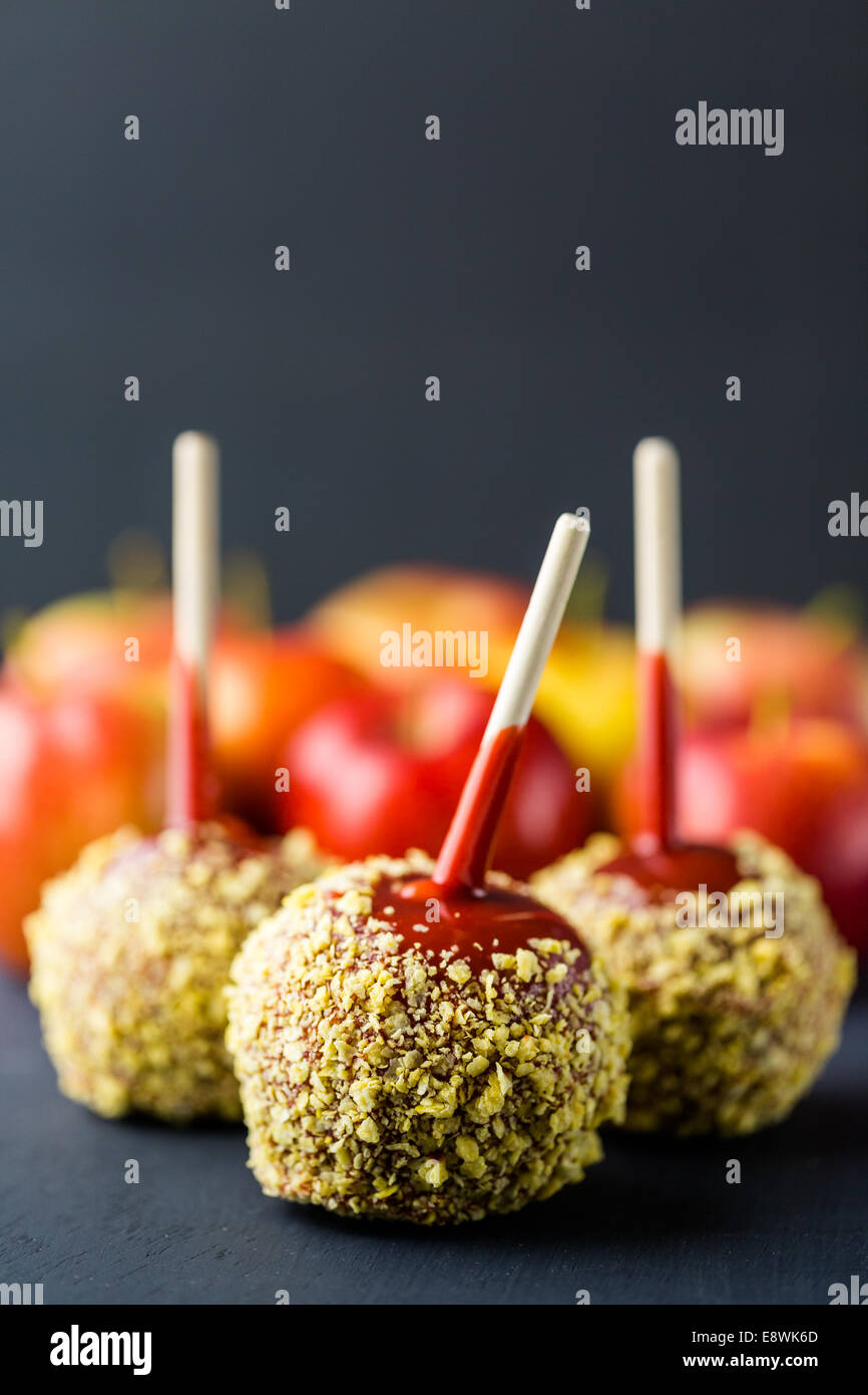 Hand dipped caramel apples decorated for Halloween Stock Photo - Alamy