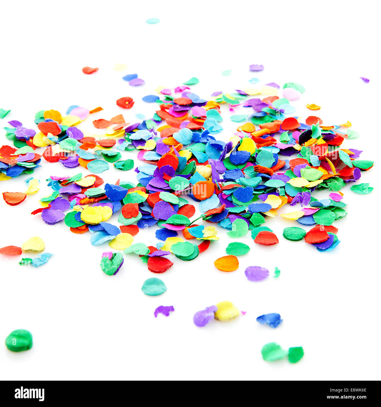 pile of colorful confetti over white background Stock Photo - Alamy