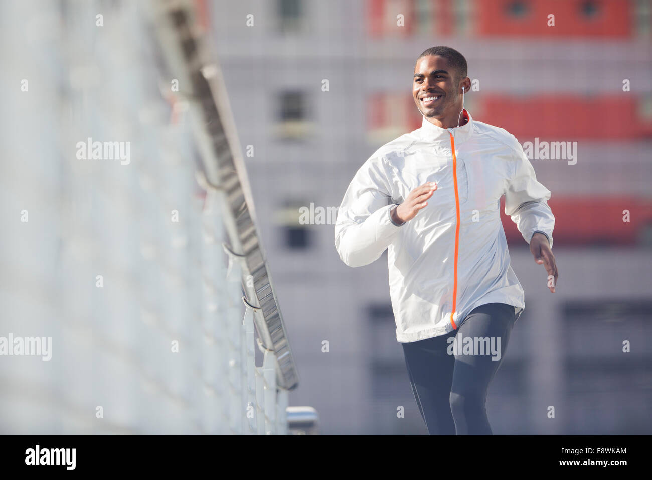 Man running through city streets Stock Photo - Alamy