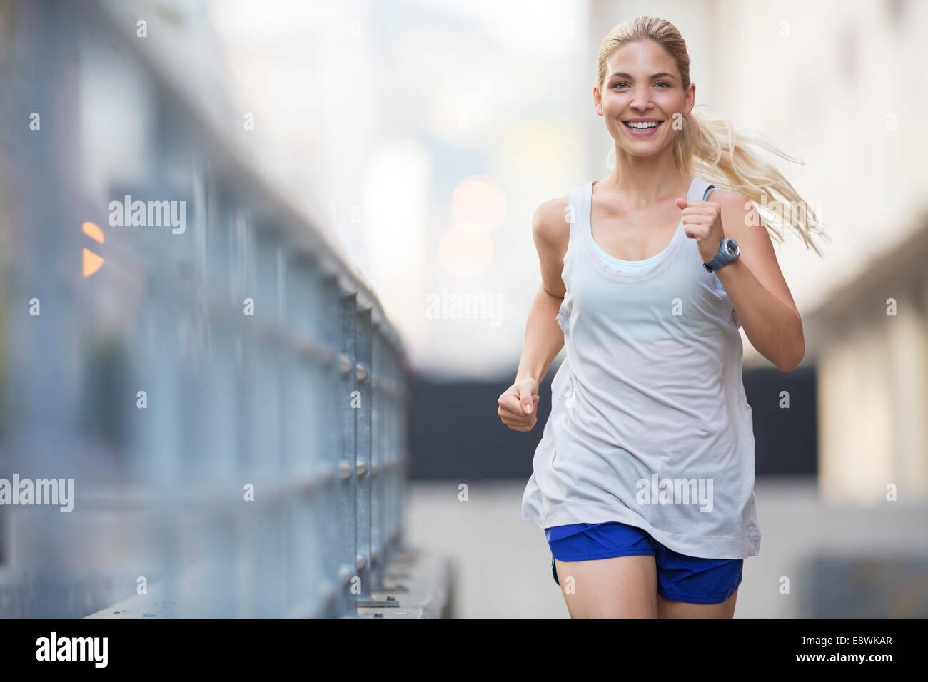 Woman running through the streets hi-res stock photography and images ...