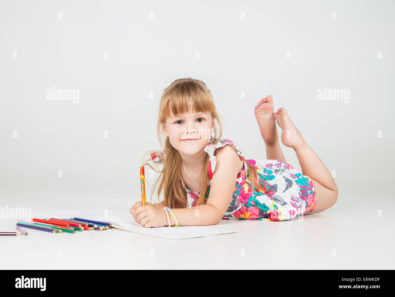 lovely girl drawing with colorful pencils Stock Photo - Alamy