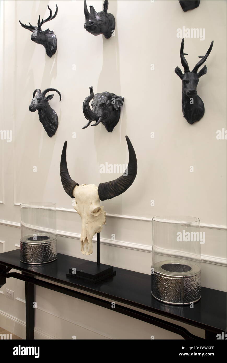 Room with a wall full of hunting animal trophy heads Stock Photo - Alamy