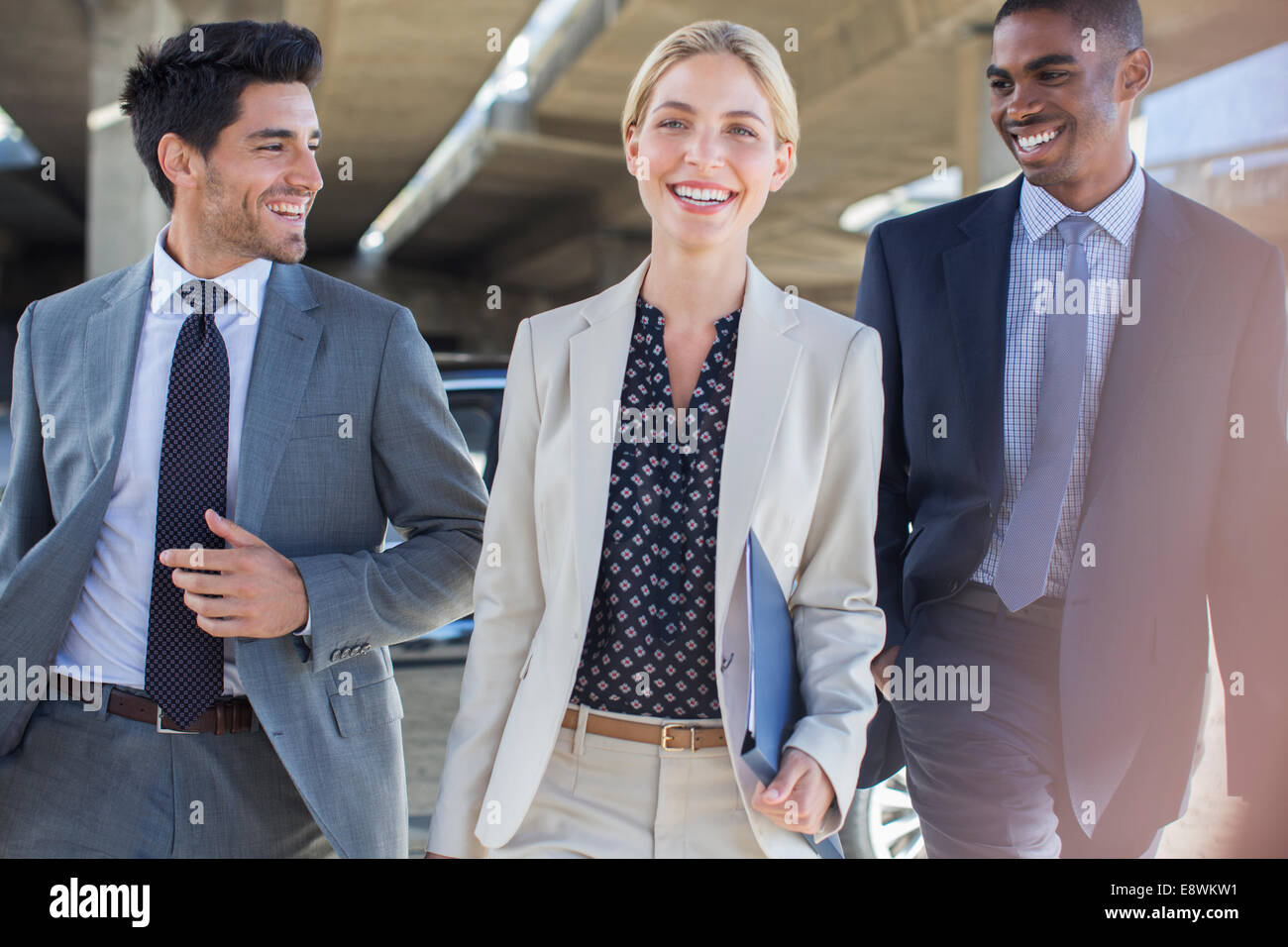 Business people walking together Stock Photo - Alamy