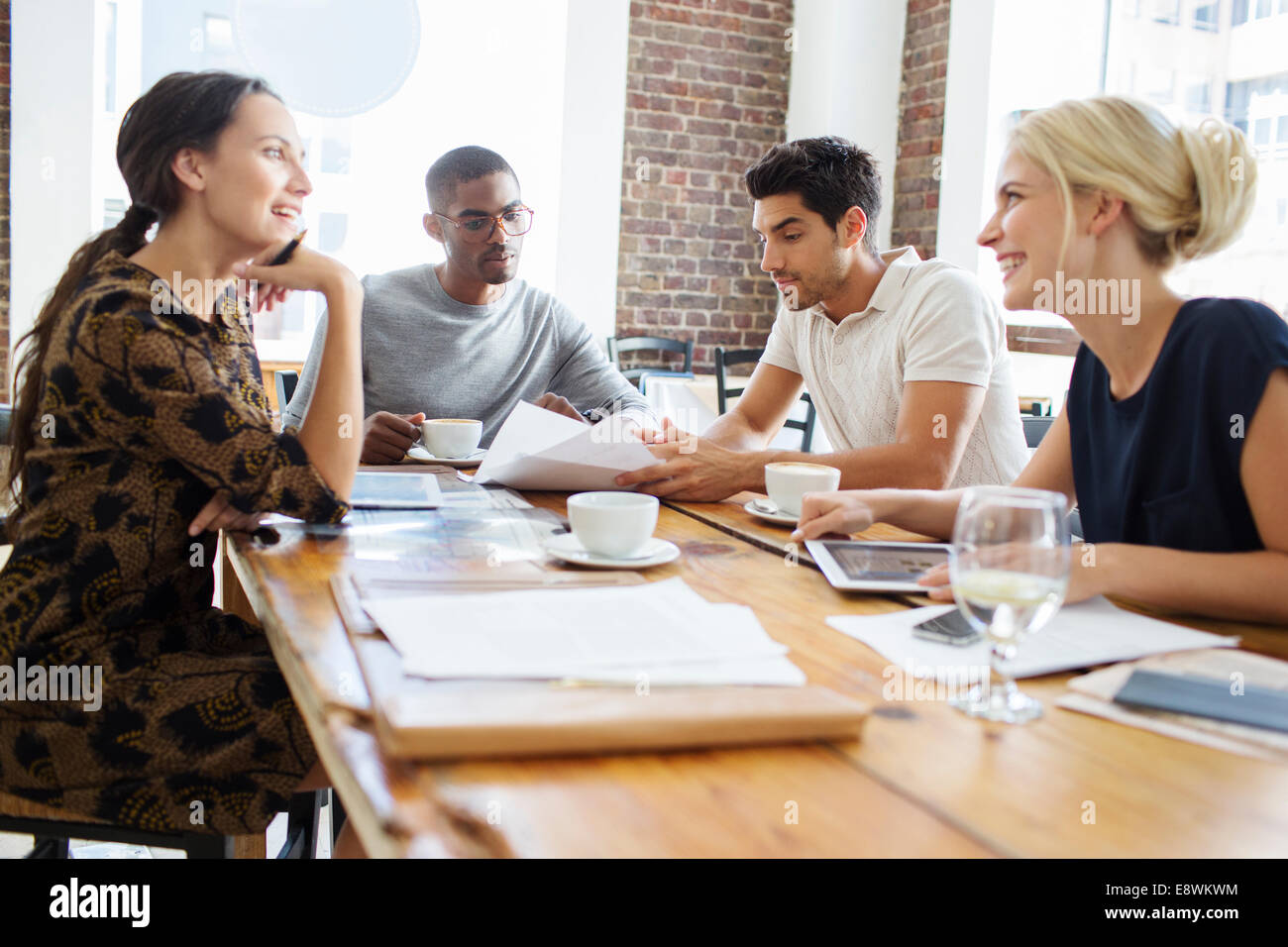 Business people talking at meeting in cafe Stock Photo - Alamy