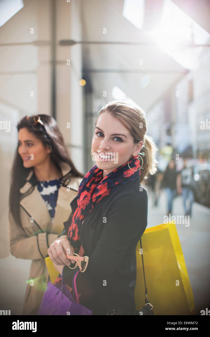 Women walking together down city street Stock Photo - Alamy