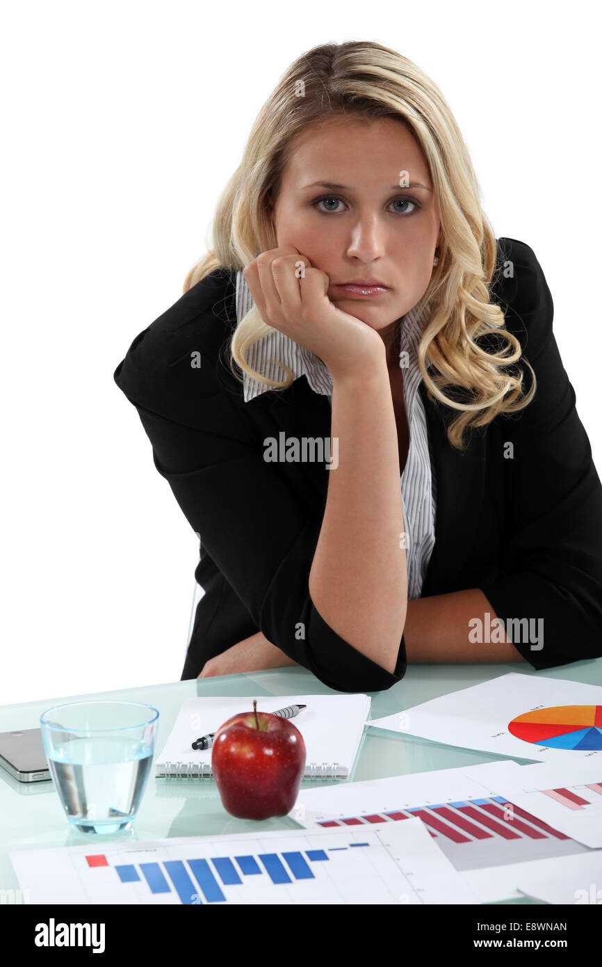 Bored female office worker Stock Photo - Alamy