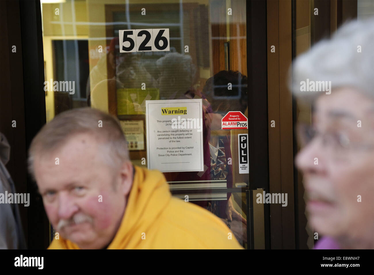 Indianola, Iowa, USA. 15th Oct, 2014. An office worker unlocks the ...