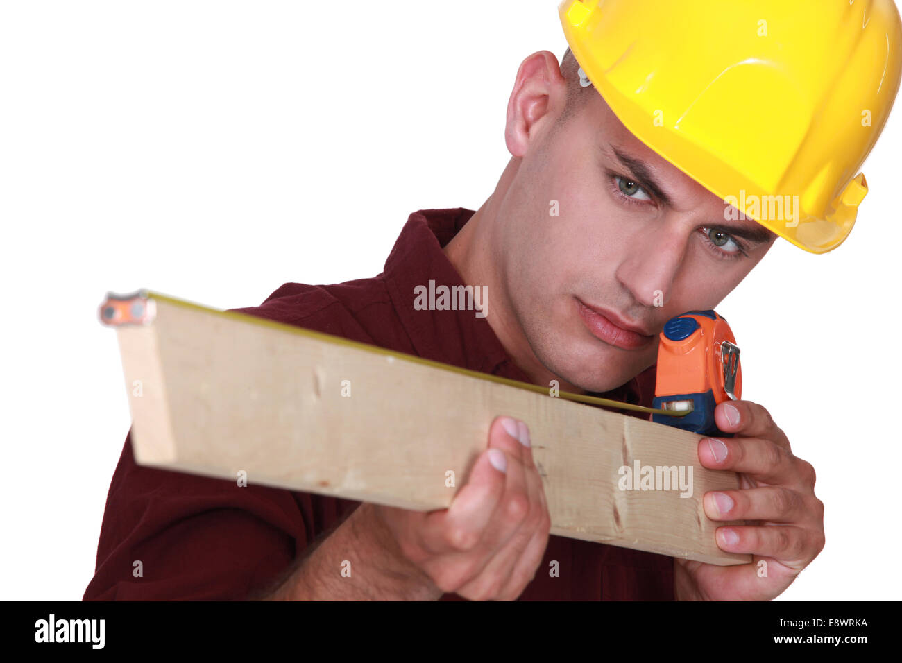 craftsman measuring a board Stock Photo - Alamy