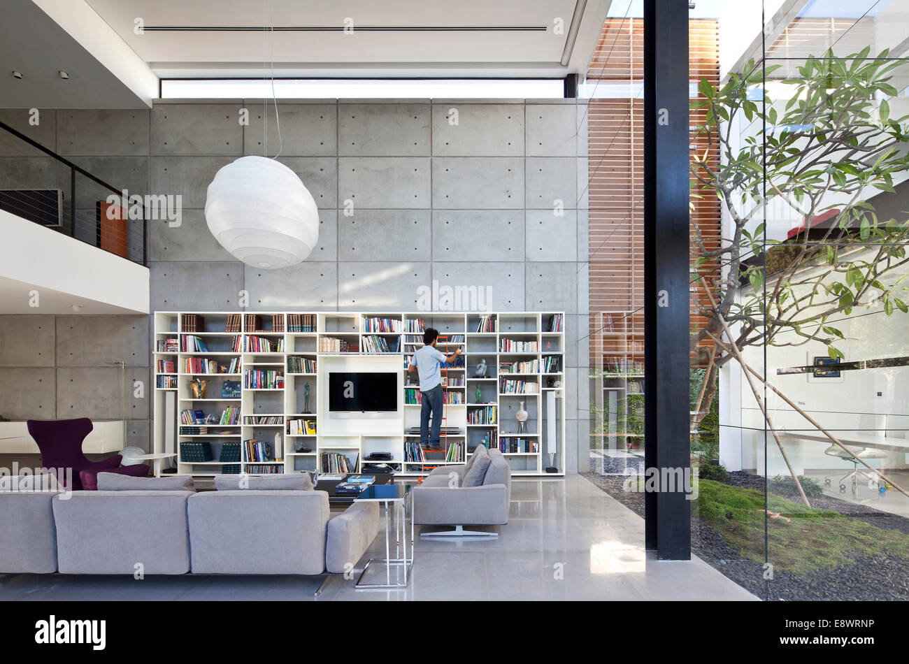 Man standing at bookcase in Dahan House, Israel, Middle East Stock ...