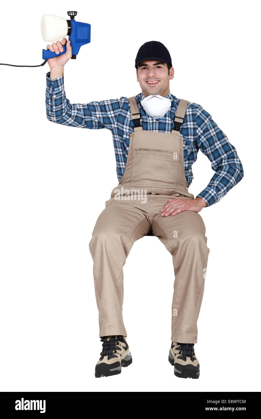Man with a paint sprayer Stock Photo - Alamy