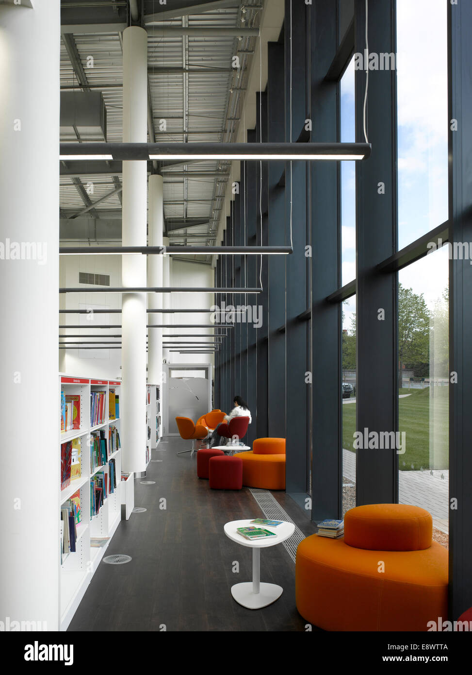 Woman sits reading near bookcases in Kent Library and History Centre ...