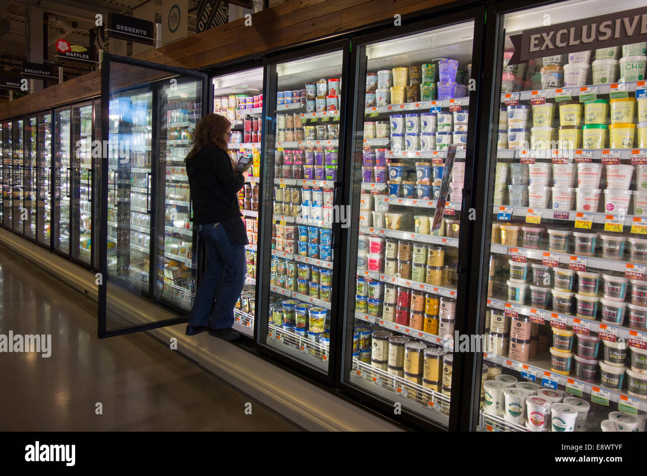 woman shopping in whole foods refrigerator Stock Photo - Alamy
