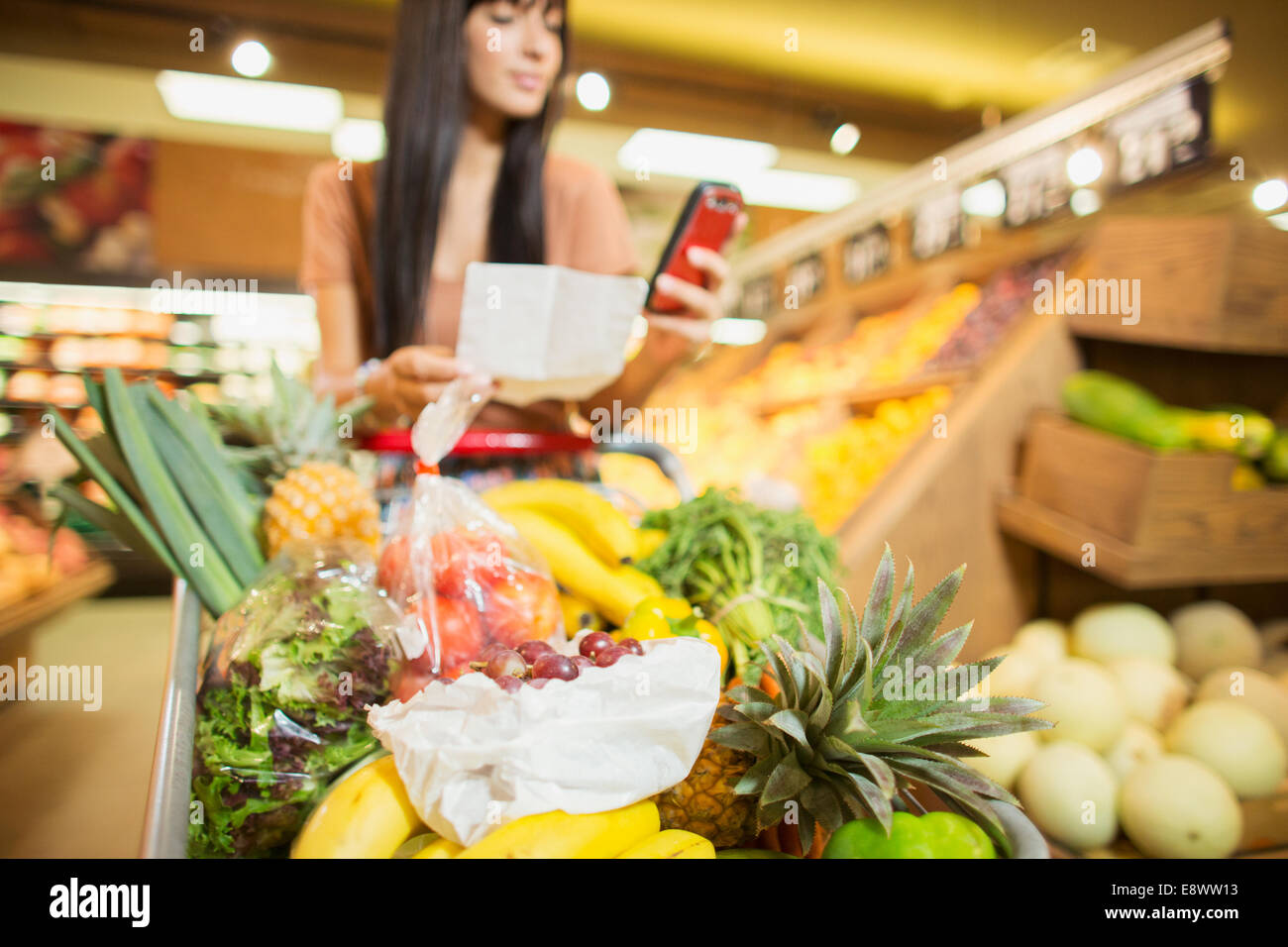 Shopper using grocery list hi-res stock photography and images - Alamy