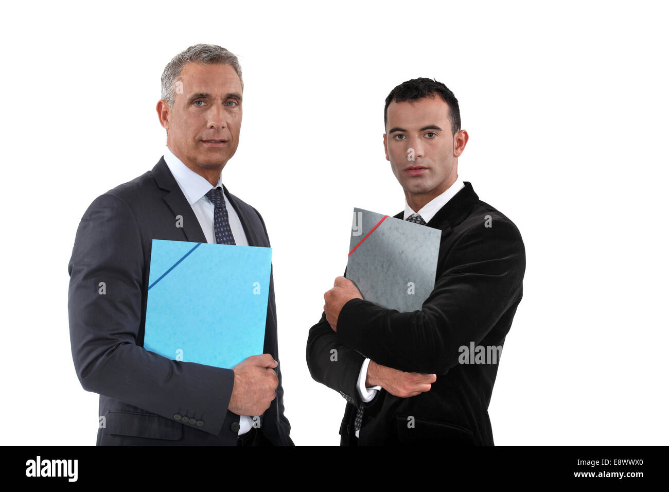 Businessmen holding folders Stock Photo - Alamy