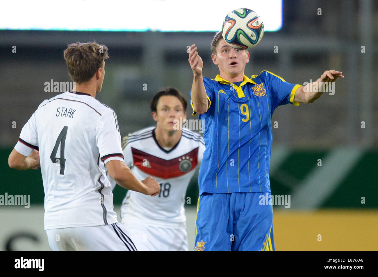 Ukraine's Vladyslav Kalitvintsev (R) plays the ball next to Germany's ...