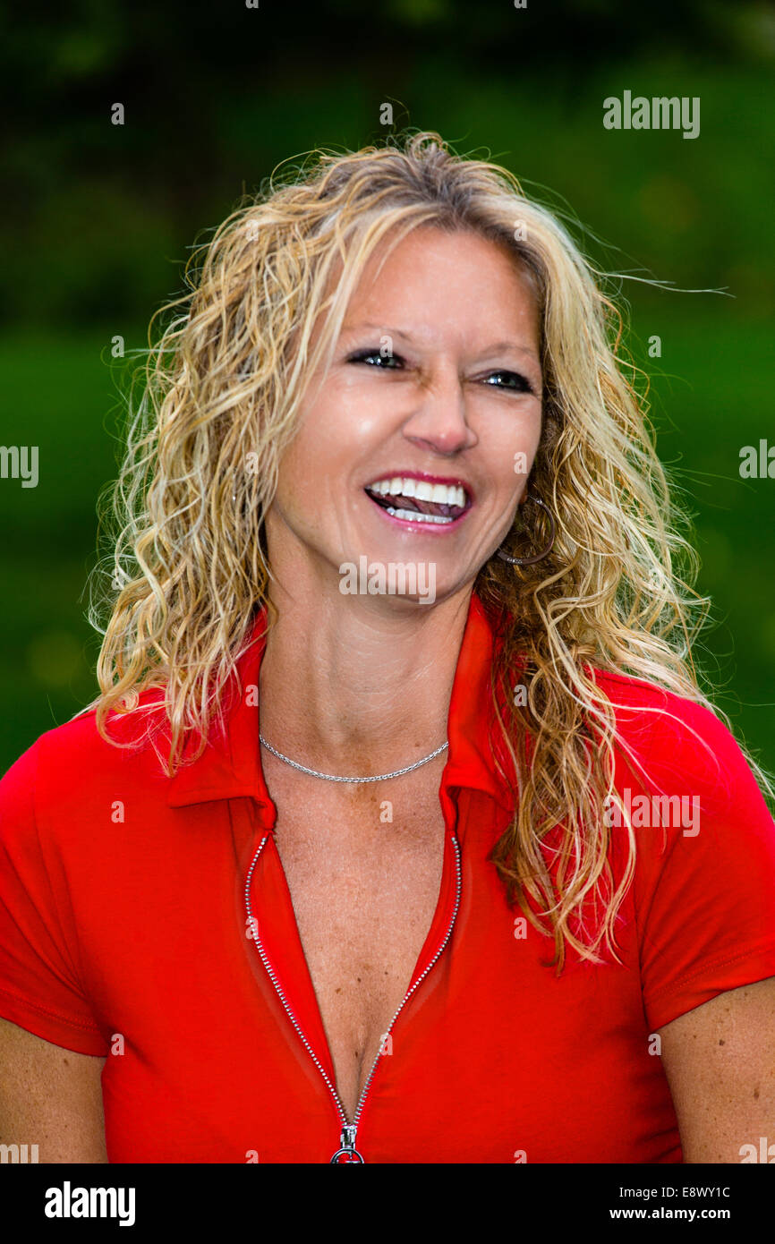 Female model in casual clothing laughing Stock Photo - Alamy