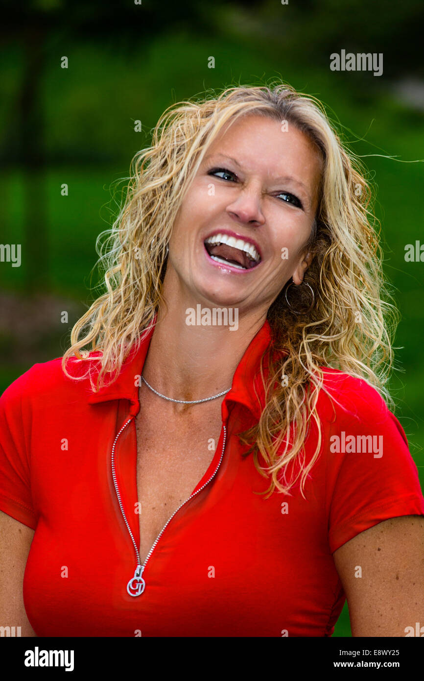 Female model in casual clothing laughing Stock Photo - Alamy