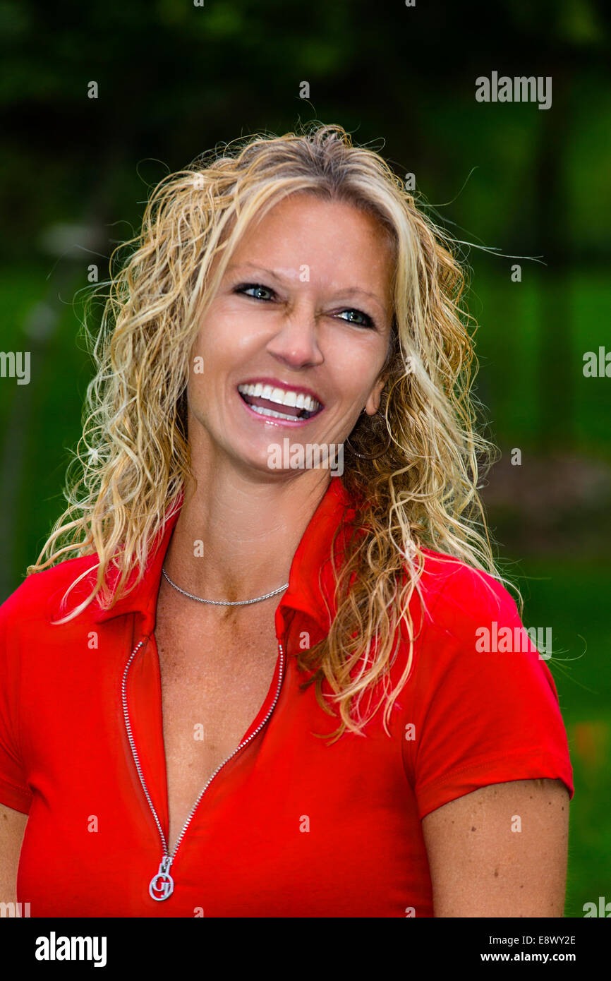 Female model in casual clothing laughing Stock Photo - Alamy