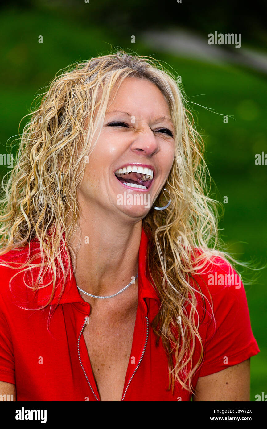 Female model in casual clothing laughing Stock Photo - Alamy