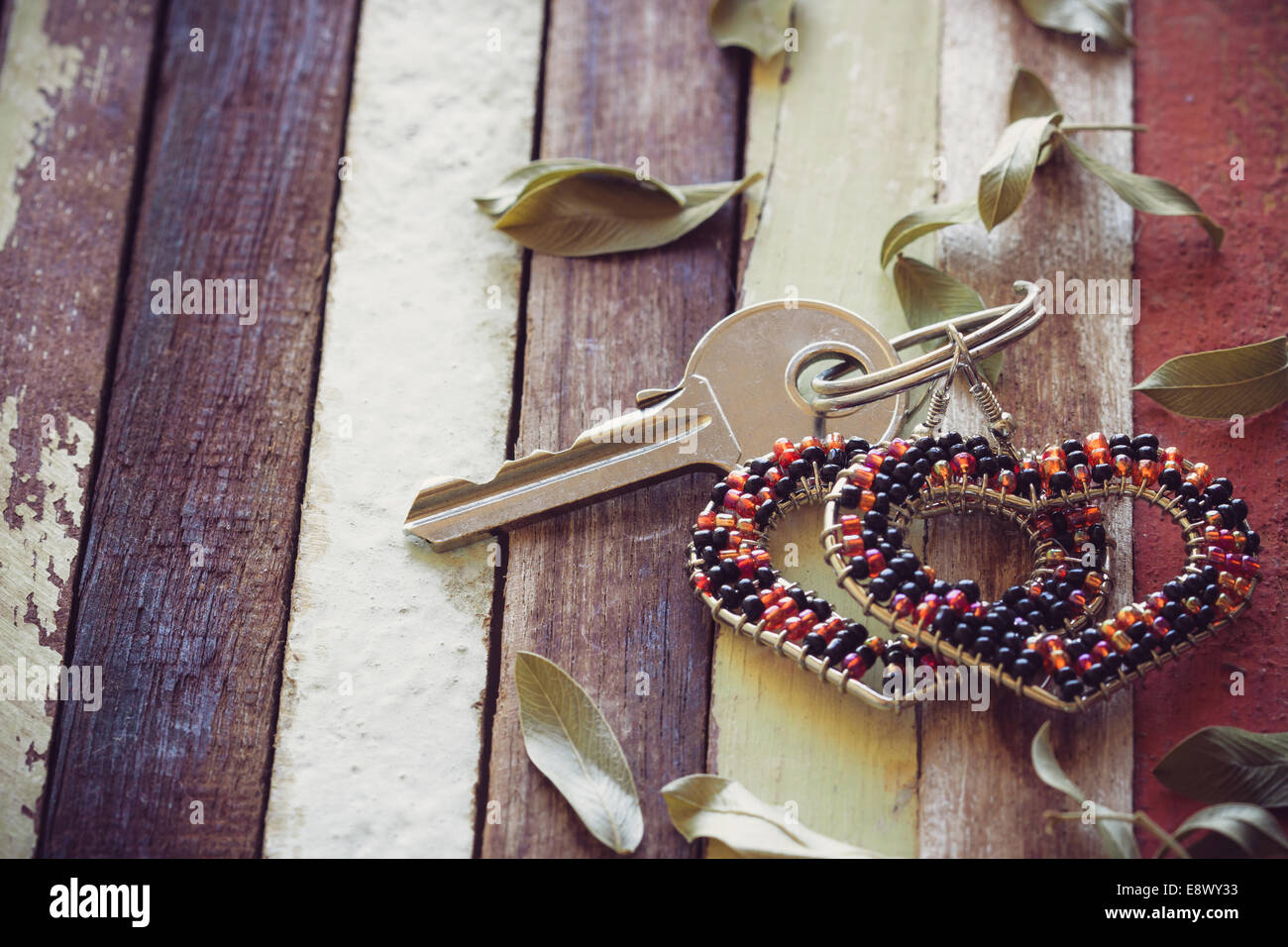 love key on wood background Stock Photo - Alamy