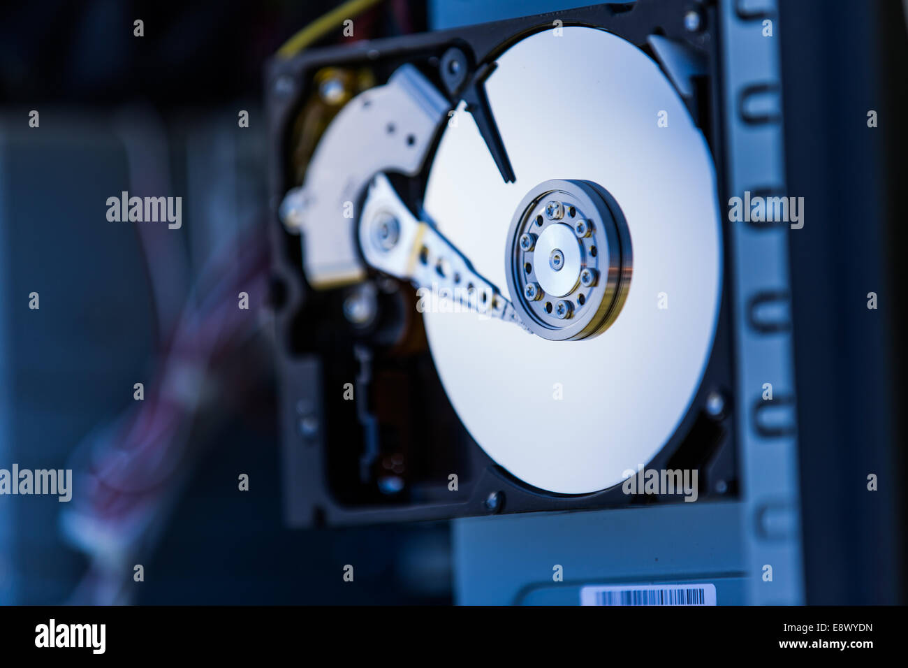 A close-up of hard disk data storage drive in a PC home computer from ...